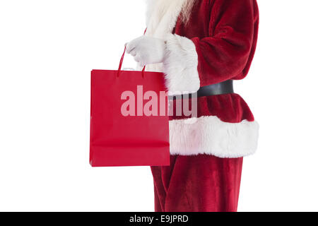 Santa carries red gift bag against red background Stock Photo - Alamy