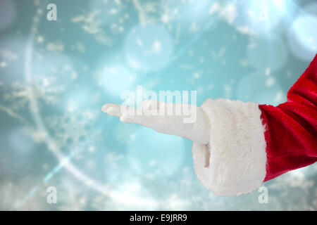 Composite image of santa claus with hand out Stock Photo - Alamy