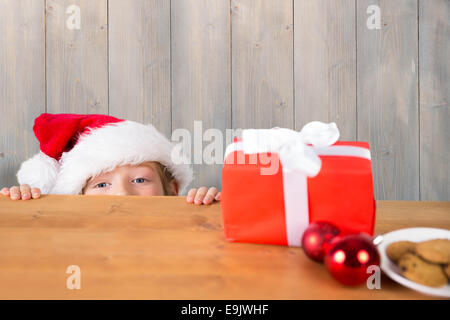 Boy Peeking over Wooden Table Stock Photo - Alamy