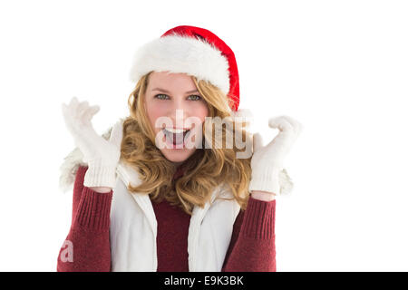 Excited woman in santa hat looking at camera isolated on red, banner ...