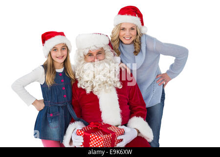 Mother and daughter with santa claus Stock Photo - Alamy