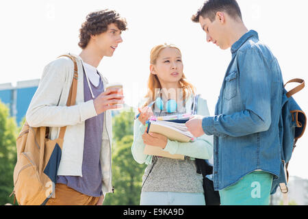 University students conversing at campus Stock Photo - Alamy