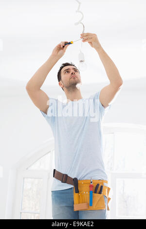 man fixing light at home Stock Photo - Alamy