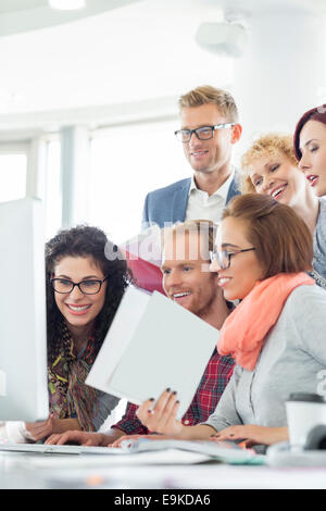 Creative business people using computer Stock Photo - Alamy
