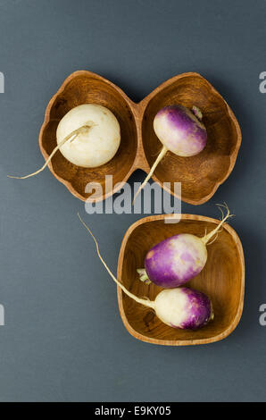 Organic turnips in different bowls over dark background Stock Photo - Alamy