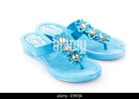 blue rubber flip-flops on a white wooden background, view from above ...