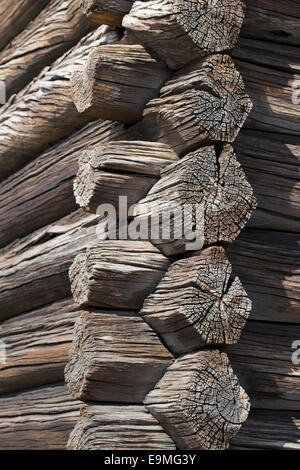 Full frame shot of log cabin with reflection of mountains on window ...