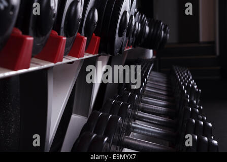 Close up of a row dumbbells on the floor at home Stock Photo - Alamy