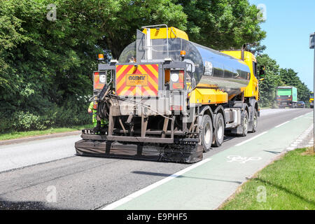 A lorry or truck tarmacing or laying tarmac on a main road Stoke-on ...