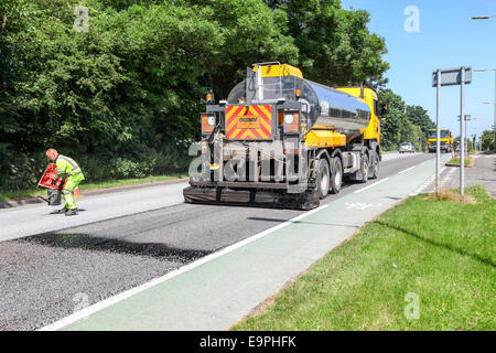 A lorry or truck tarmacing or laying tarmac on a main road Stoke-on ...