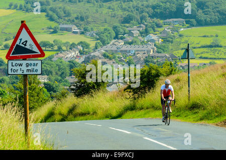 Cyclist tackling the Nick of Pendle climb during sportive event in the ...