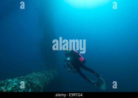 Diver Underwater at Oil Rig Platform Stock Photo - Alamy