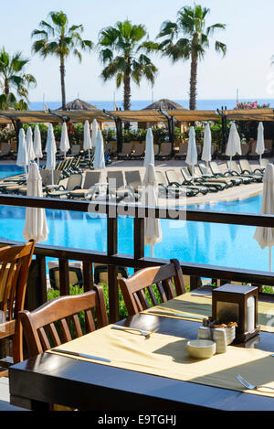 Cosy cafe with beautiful pool Stock Photo - Alamy