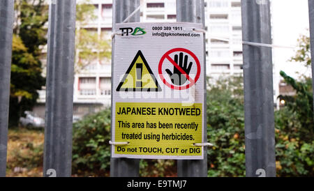 A sign warning of Japanese knotweed and warning of controlled entry ...