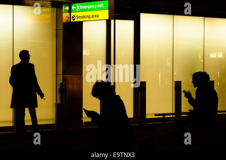 smoking smokers cigarettes smoking outside building during break Stock ...