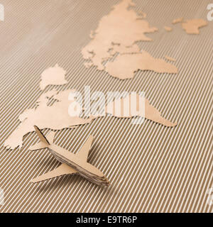 Airplane and world map made of cardboard Stock Photo - Alamy