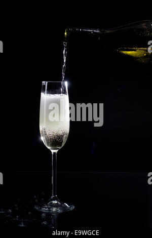 Prosecco is poured into a glass Stock Photo - Alamy