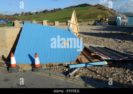 Charmouth, Dorset, UK. 3rd Nov, 2014. Workmen clear damaged beach huts ...