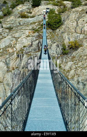 Stressed-ribbon bridge across Massa Gorge, Belalp tourism region ...