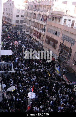 Muslim devotees participate in the religious procession during the ...