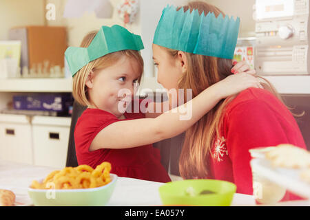 Two teenage girls hugging in airport Stock Photo - Alamy