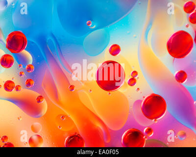 Abstract colorful backdrop with oil drops and waves on water surface ...