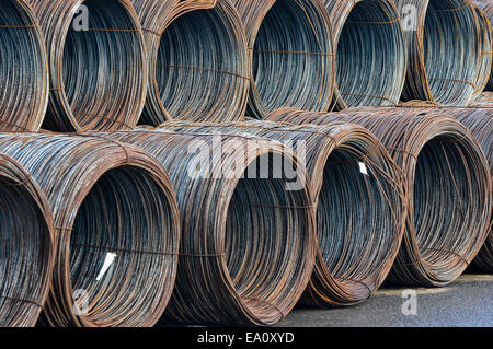 Steel wire coils in storage Stock Photo - Alamy