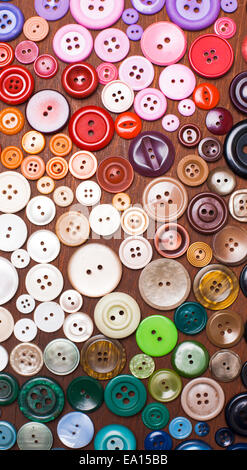 pile of various colors and design buttons, glossy and vibrant colored ...