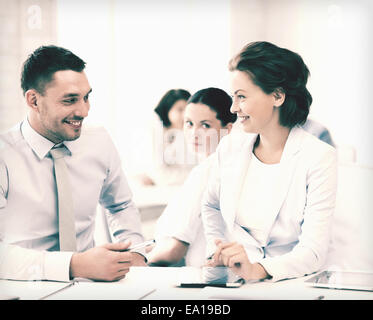 Happy business team members talking outside in Stock Photo - Alamy