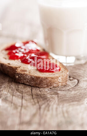 Bread with strawberry jam and glass of milk Stock Photo - Alamy