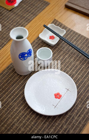 Japanese style table set and sake bottle and cup Stock Photo - Alamy
