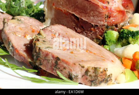 Roasted pork roll with mushrooms and vegetables Stock Photo - Alamy