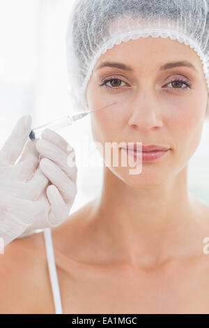 Attractive woman having botox injection Stock Photo - Alamy