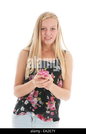 Teenager girl standing over pink background with hands together and ...