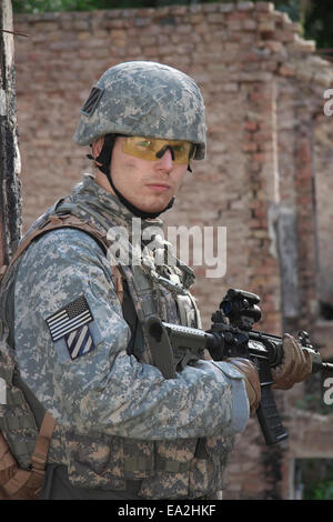 US Soldier on urban patrol mission aiming (portrait Stock Photo - Alamy