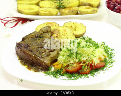 Tasty hot grilled bone pork steak served sauce Stock Photo - Alamy