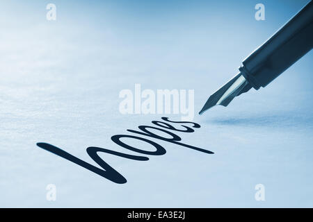 Fountain pen writing the word hopes Stock Photo - Alamy