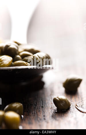 Capers on the spoon Stock Photo - Alamy
