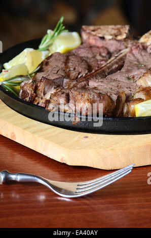 Stake from mutton with a lemon Stock Photo - Alamy