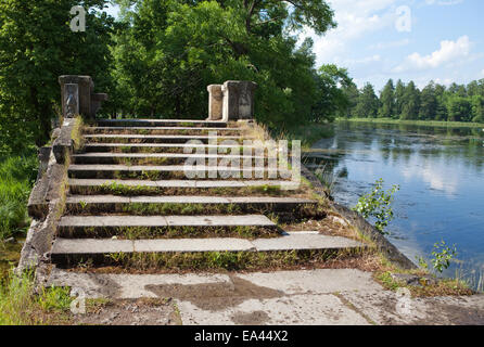 The old destroyed bridge in park Stock Photo - Alamy