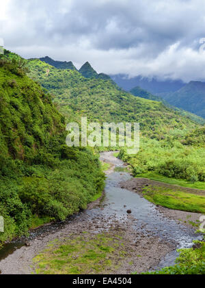 Tahiti. Polynesia. Clouds over a mountain landscape Stock Photo - Alamy