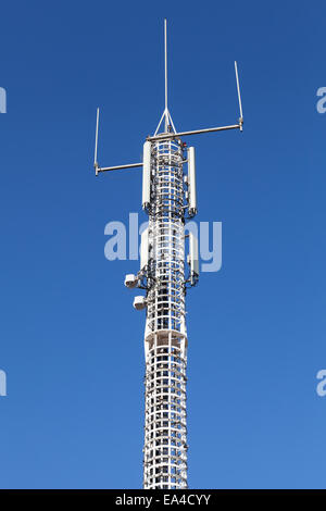 Telecommunication radio tower with devices above cloudy sky Stock Photo ...