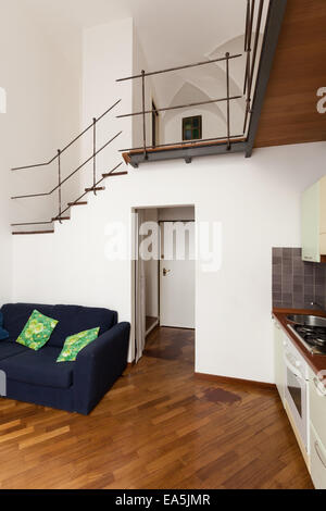 Light small home kitchen with wide window furnished with cupboards and ...