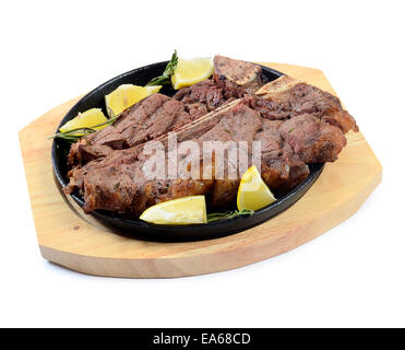 Stake from mutton with a lemon Stock Photo - Alamy