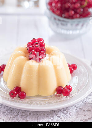 Vanilla pudding with red currants Stock Photo - Alamy