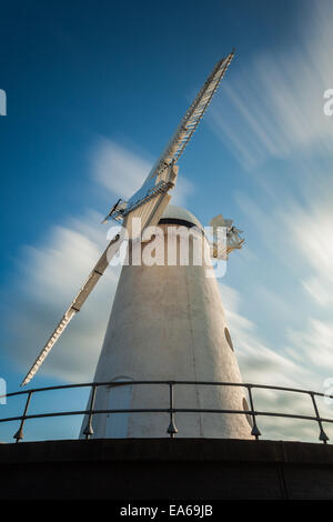 Stone cross and windmill Stock Photo - Alamy