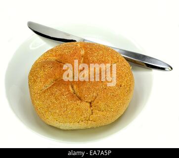 Whole wheat kaiser roll on a black background Stock Photo - Alamy