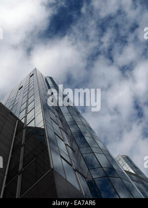 A tall city building and houses Stock Photo - Alamy