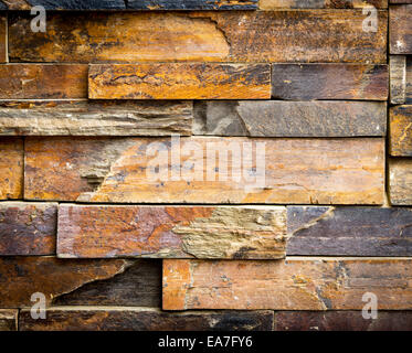 Stacked stone cladding building facade for background texture Stock ...
