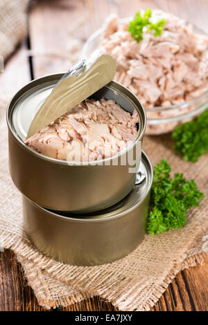 Portion of Tuna with fresh parsly on wooden background Stock Photo - Alamy